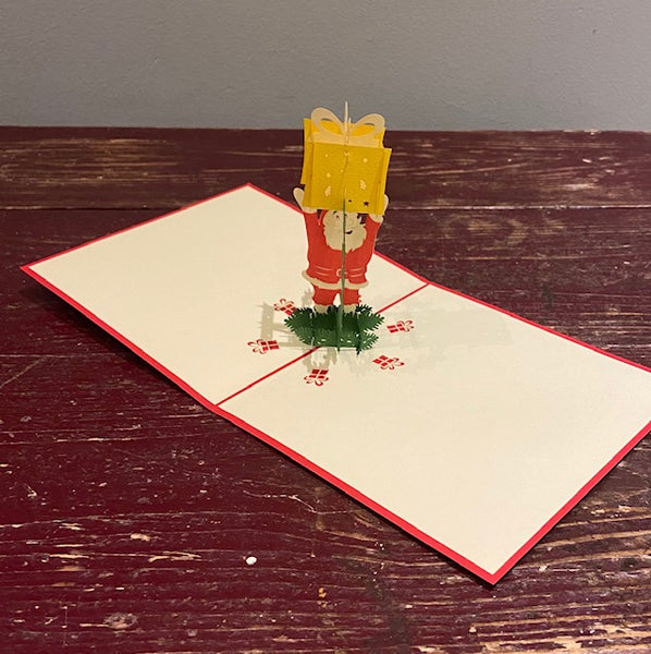 Santa Holding a Present – Purple Gallery